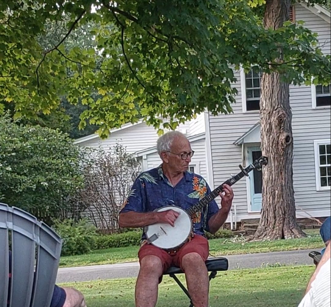 A Banjo Playing Man – Star Light Gardens